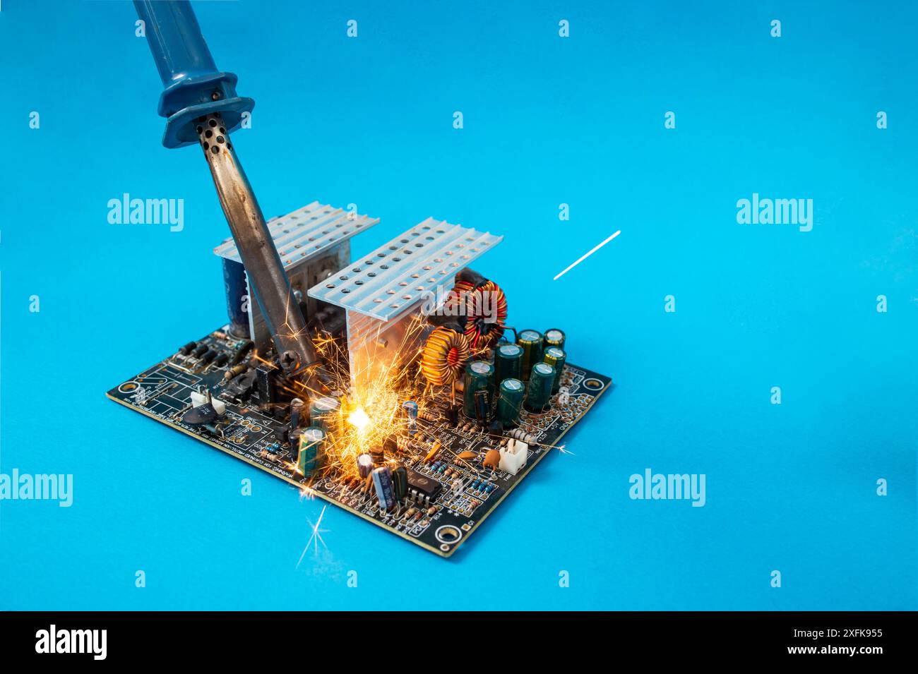 Close up of a soldering iron working on a motherboard circuit, short ...
