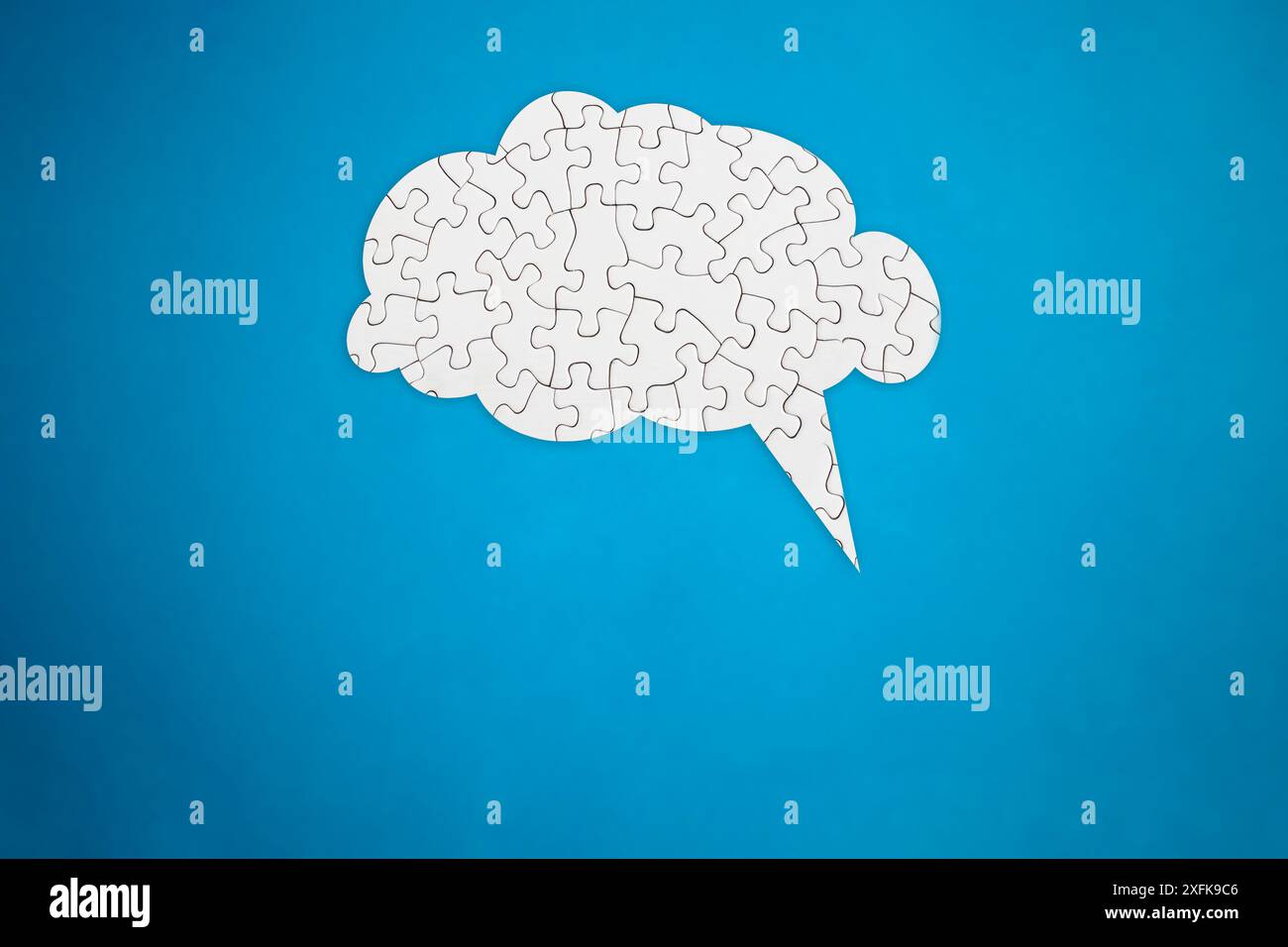 Brain shaped white jigsaw puzzle on blue background, mental health and ...