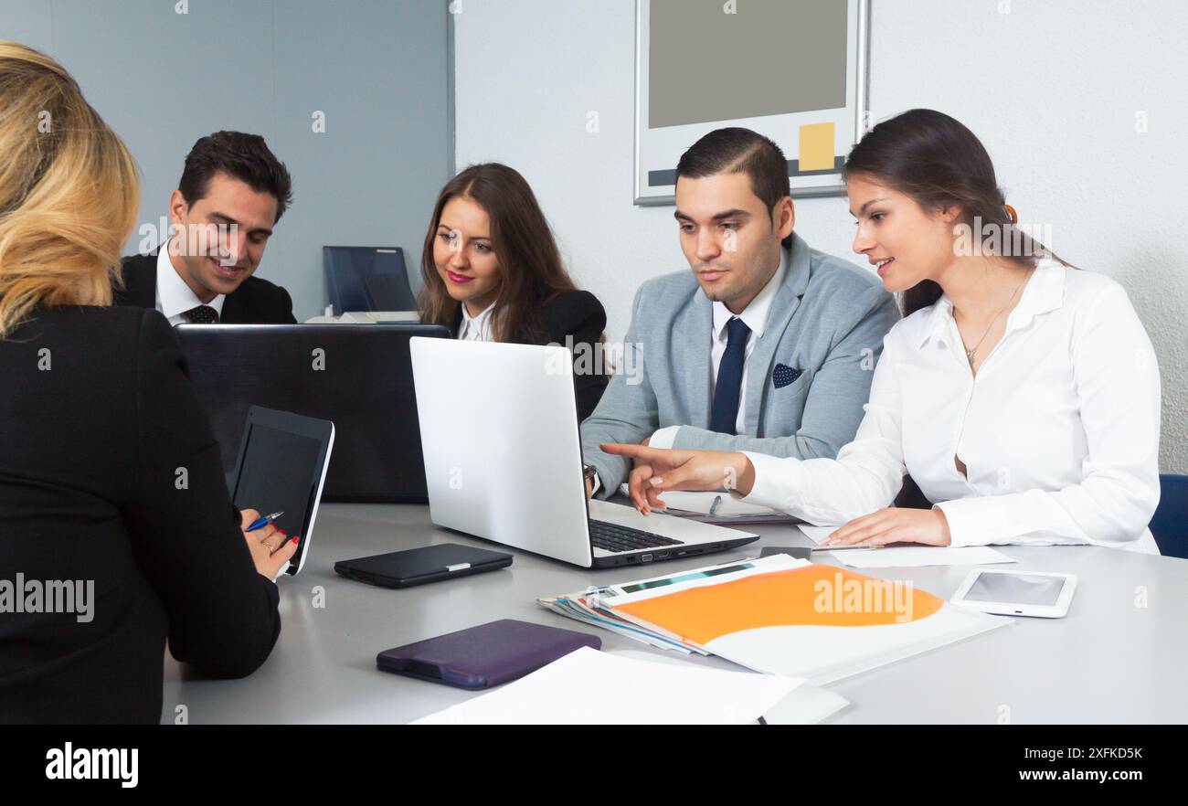 Students at negotiations in a conference room with their teacher Stock ...