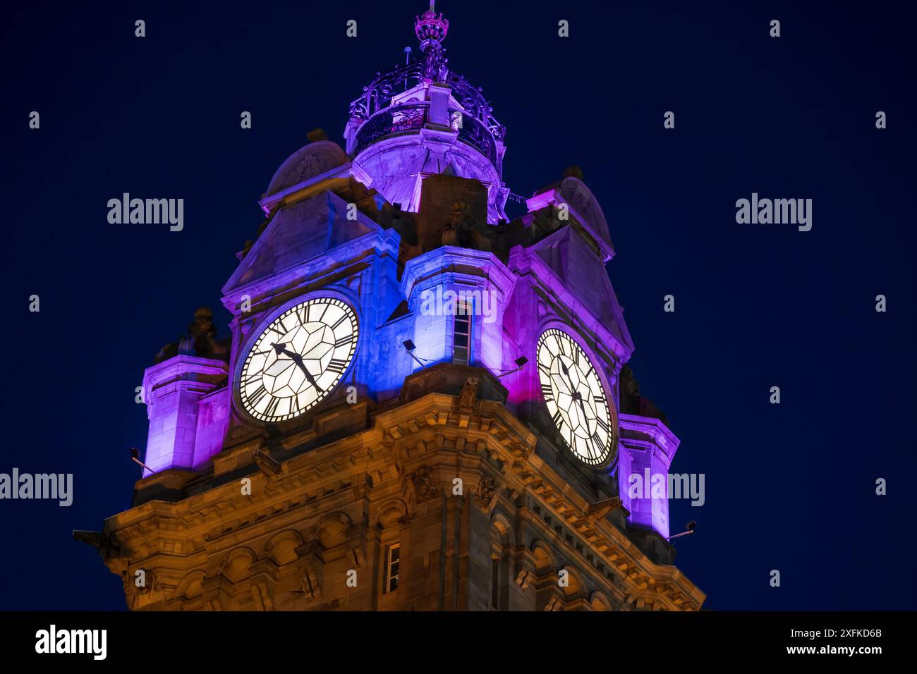 Iconic clock tower of Balmoral Hotel at night in Edinburgh, Scotland ...