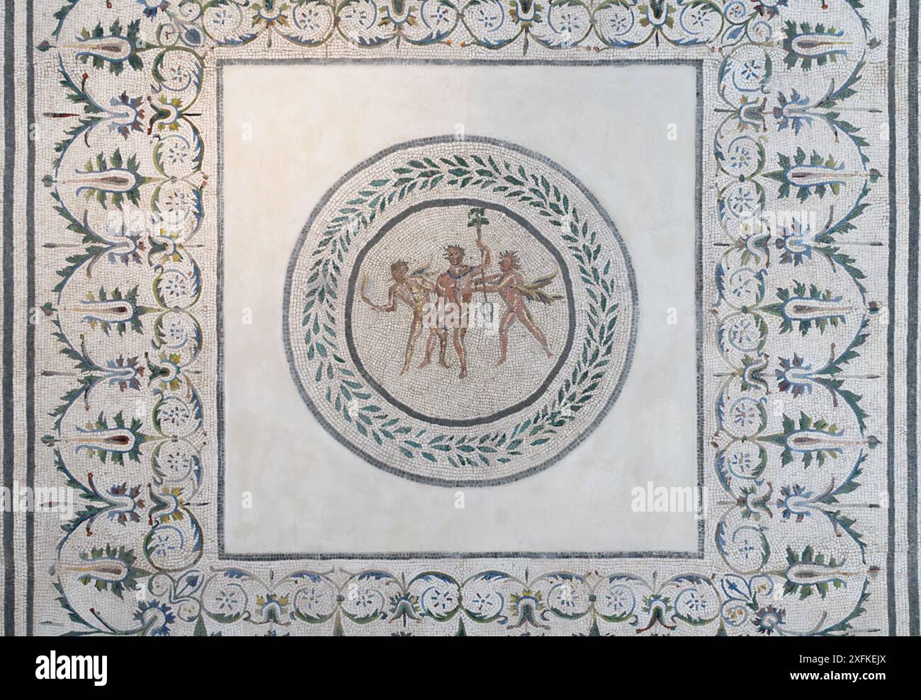 Geometric floor mosaic decorated with a central circular panel ...