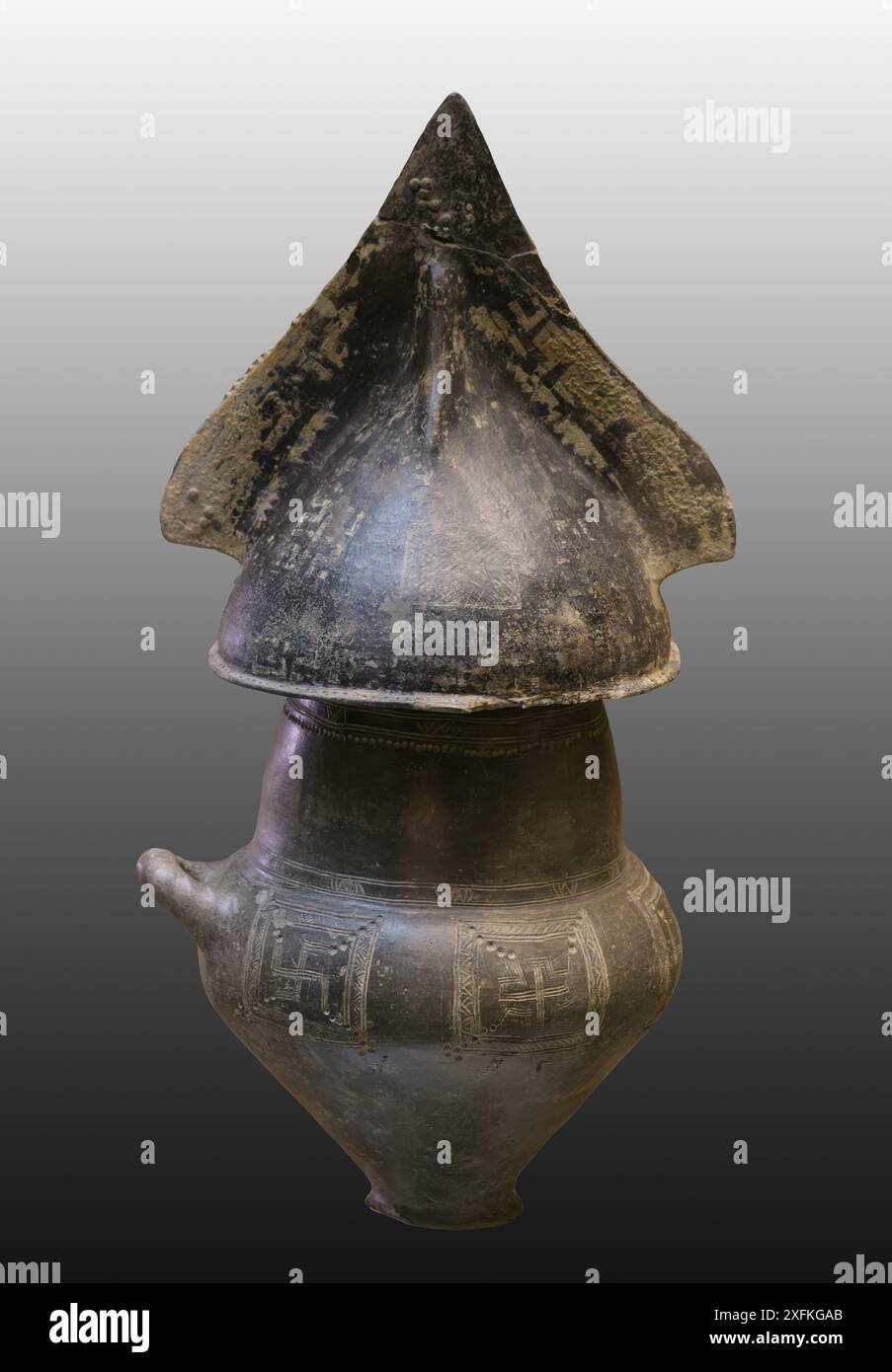 Villanovan biconical cinerary urn with impasto pottery lid in the shape ...