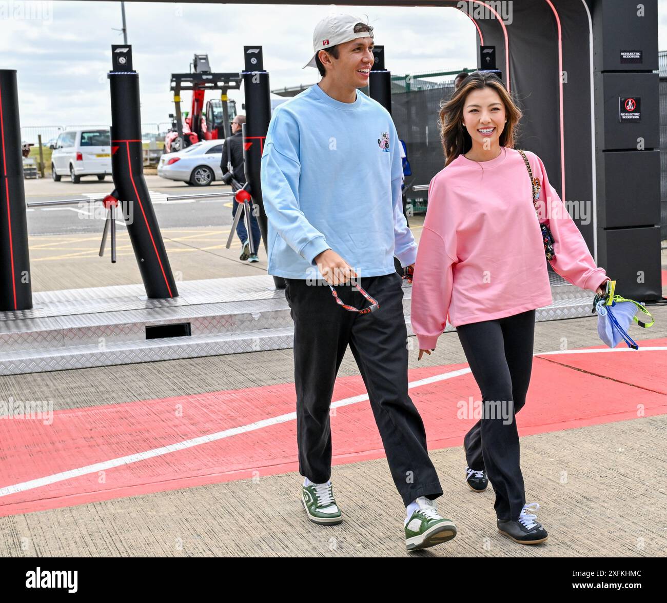 Towcester, UK, 04 July 2024. Alex Albon arrives with his girlfriend ...