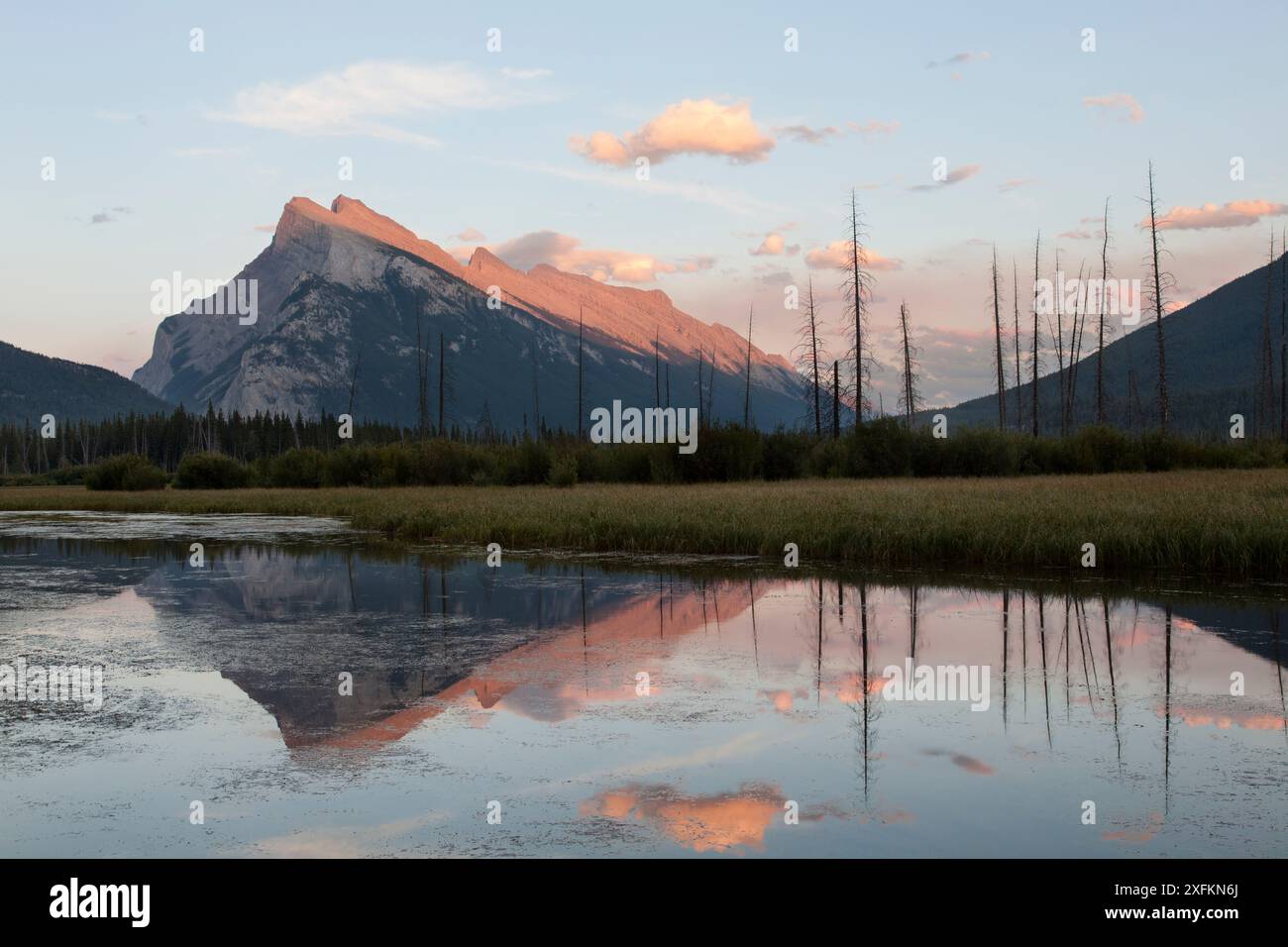 Mount Rundle at dusk, seen from Vermillion Lakes in Banff National Park ...