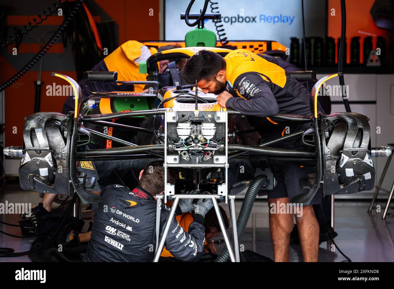 McLaren F1 Team MCL38, mechanic working on the car in the garage, box ...