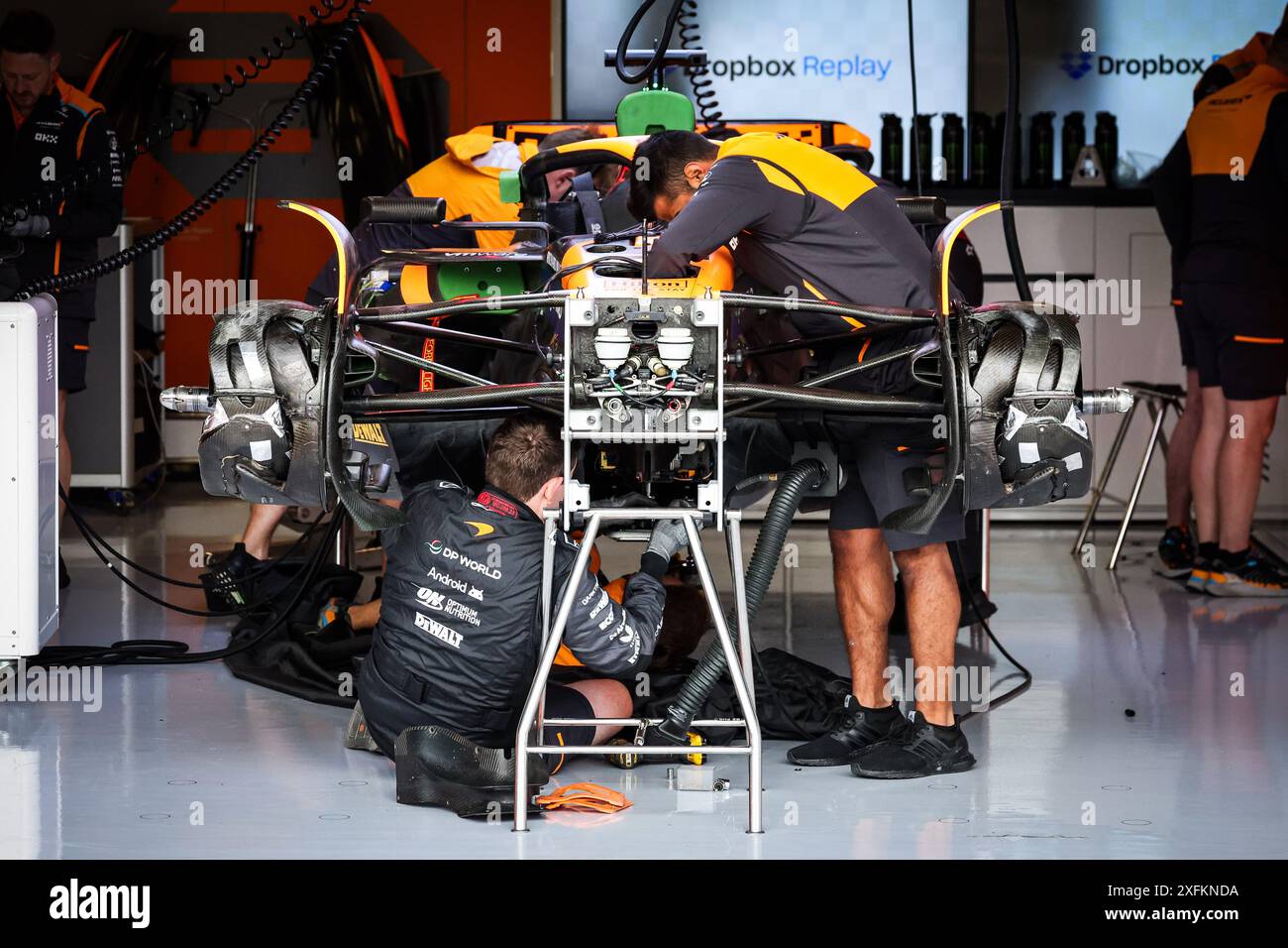 McLaren F1 Team MCL38, mechanic working on the car in the garage, box ...