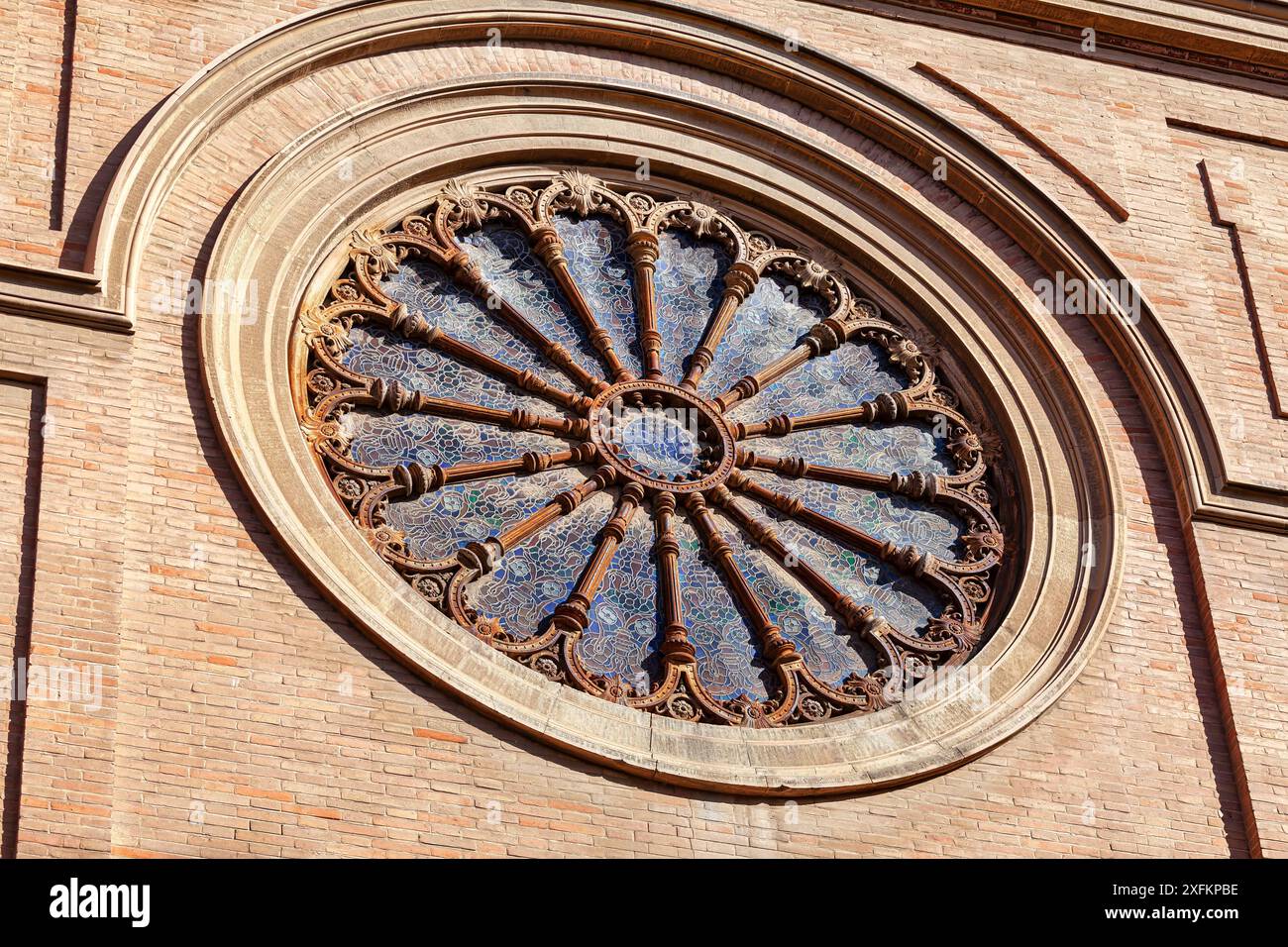Stained glass window with a blue circle in the center. The window is on ...