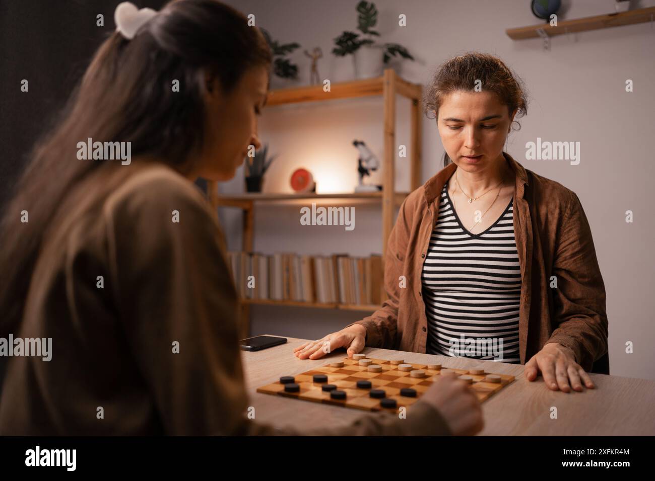 Couple playing checkers table hi-res stock photography and images - Alamy