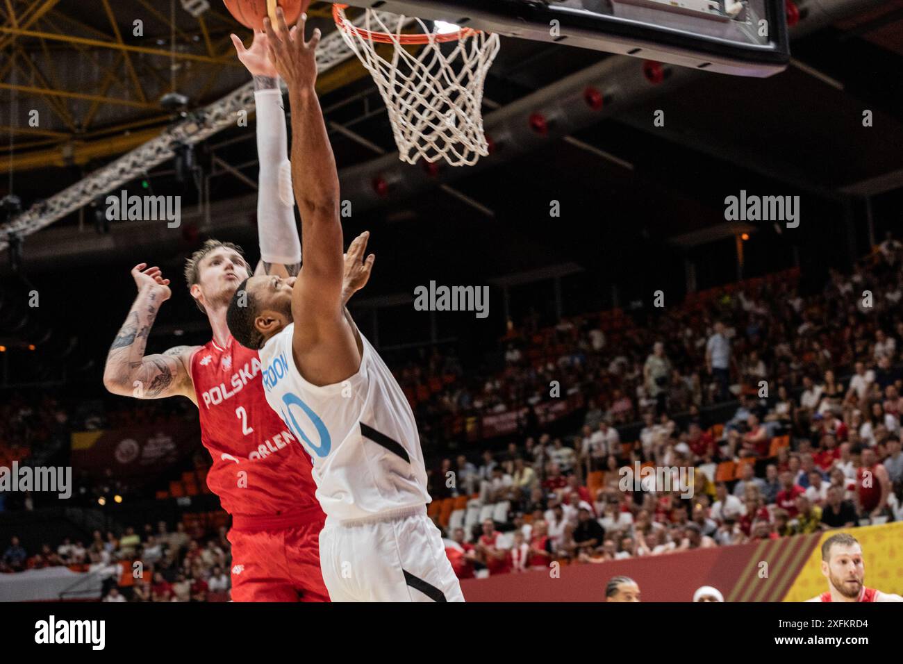 Eric Gordon (R) of Bahamas and Aleksander Balcerowski (L) of Poland in ...