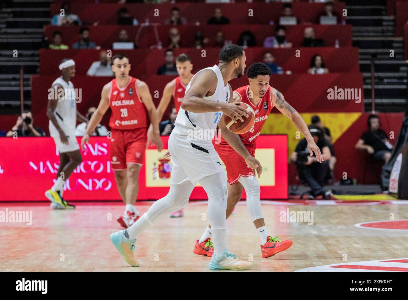 Eric Gordon (L) of Bahamas and A.J. Slaughter (R) of Poland in action ...