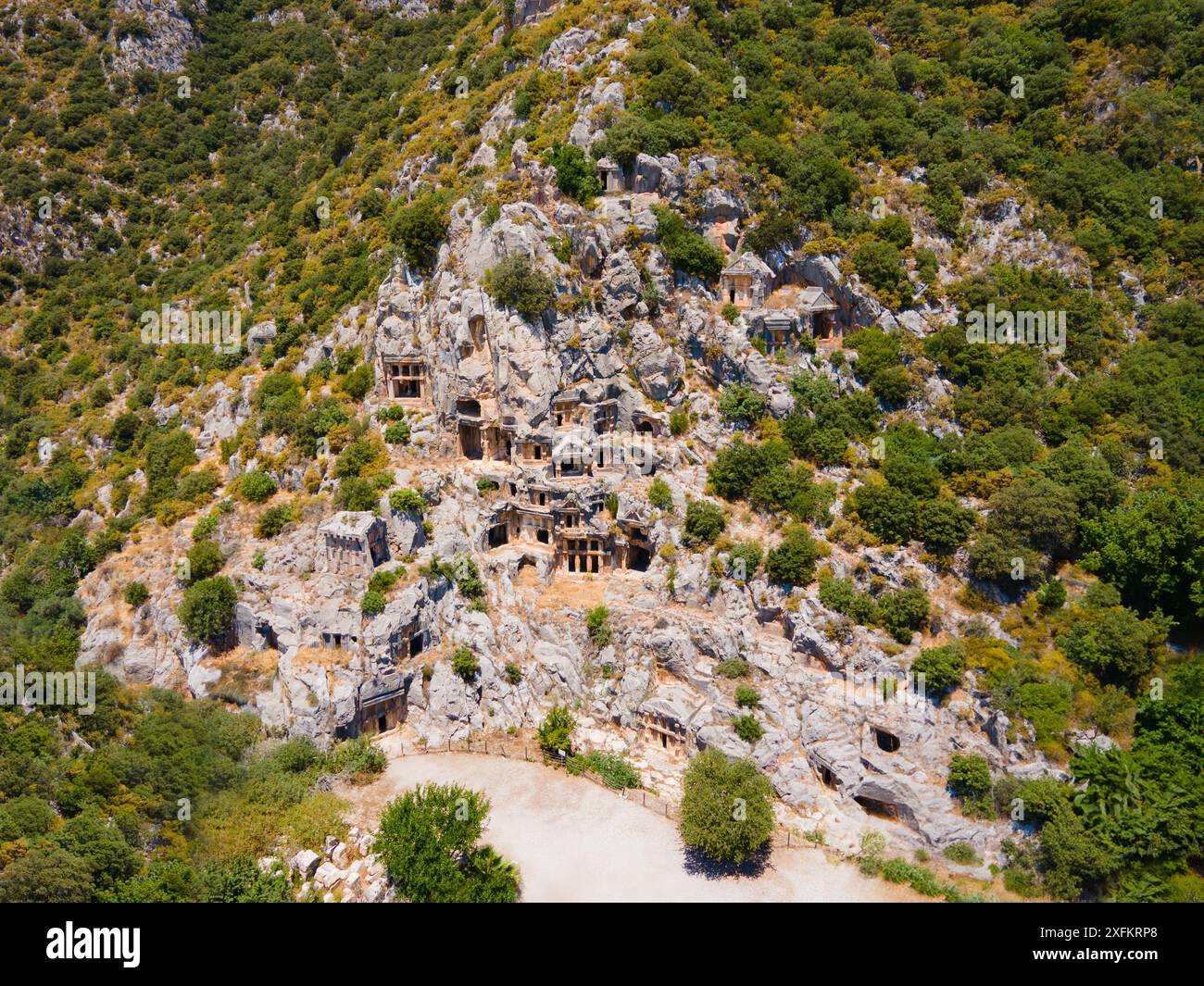 Myra ancient city ruins with rock cut tombs aerial panoramic view. Myra is located in Demre city ...