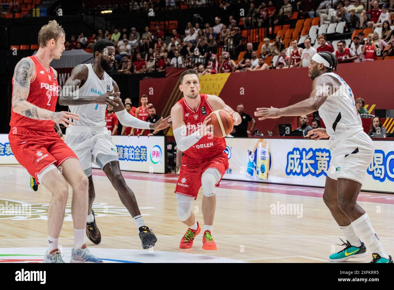 Buddy Hield (R) of Bahamas and Mateusz Ponitka (C) of Poland in action ...