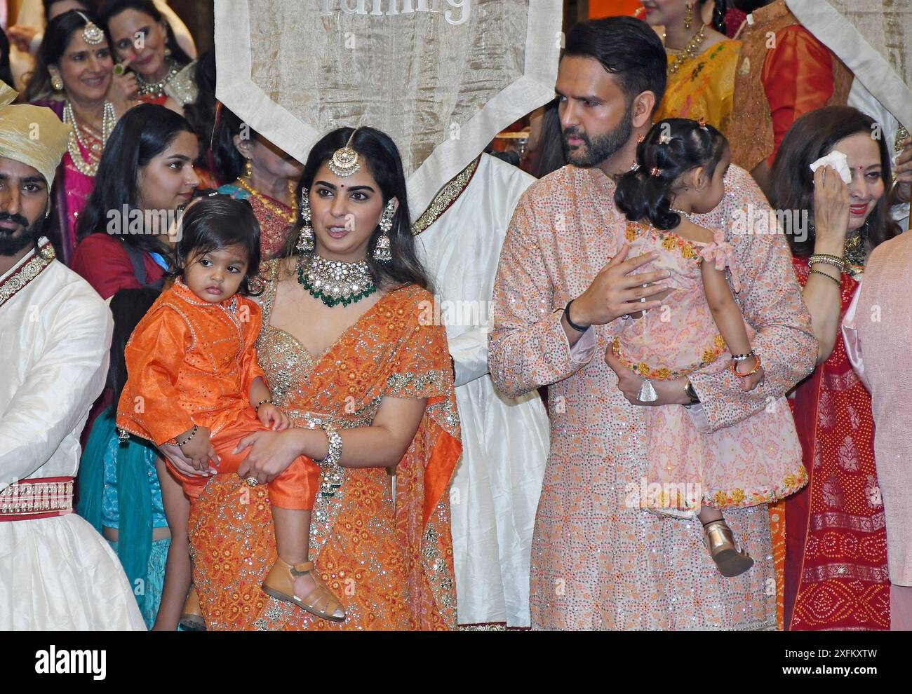 (L-R) Isha Ambani and Anand Piramal pose for a photo with their ...
