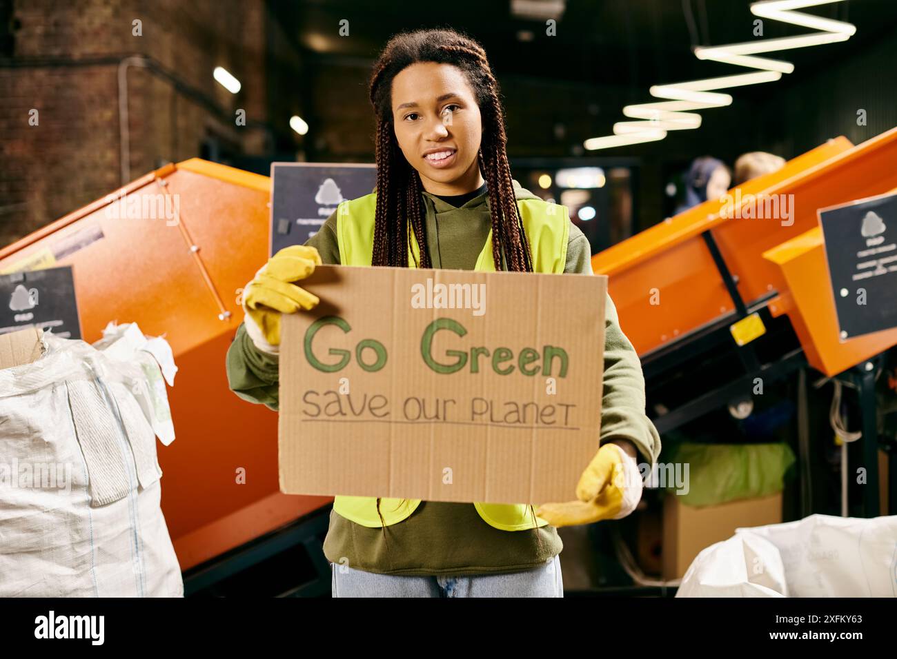 Passionate environmental activist holds sign hi-res stock photography ...