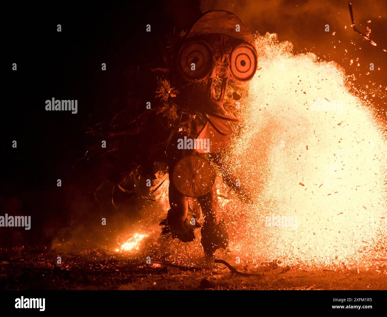 Baining men in traditional fire dance ceremony. Men enter a trance like ...