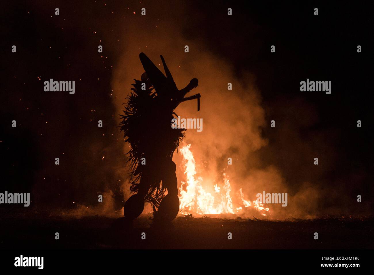 Baining men in traditional fire dance ceremony. Men enter a trance like ...