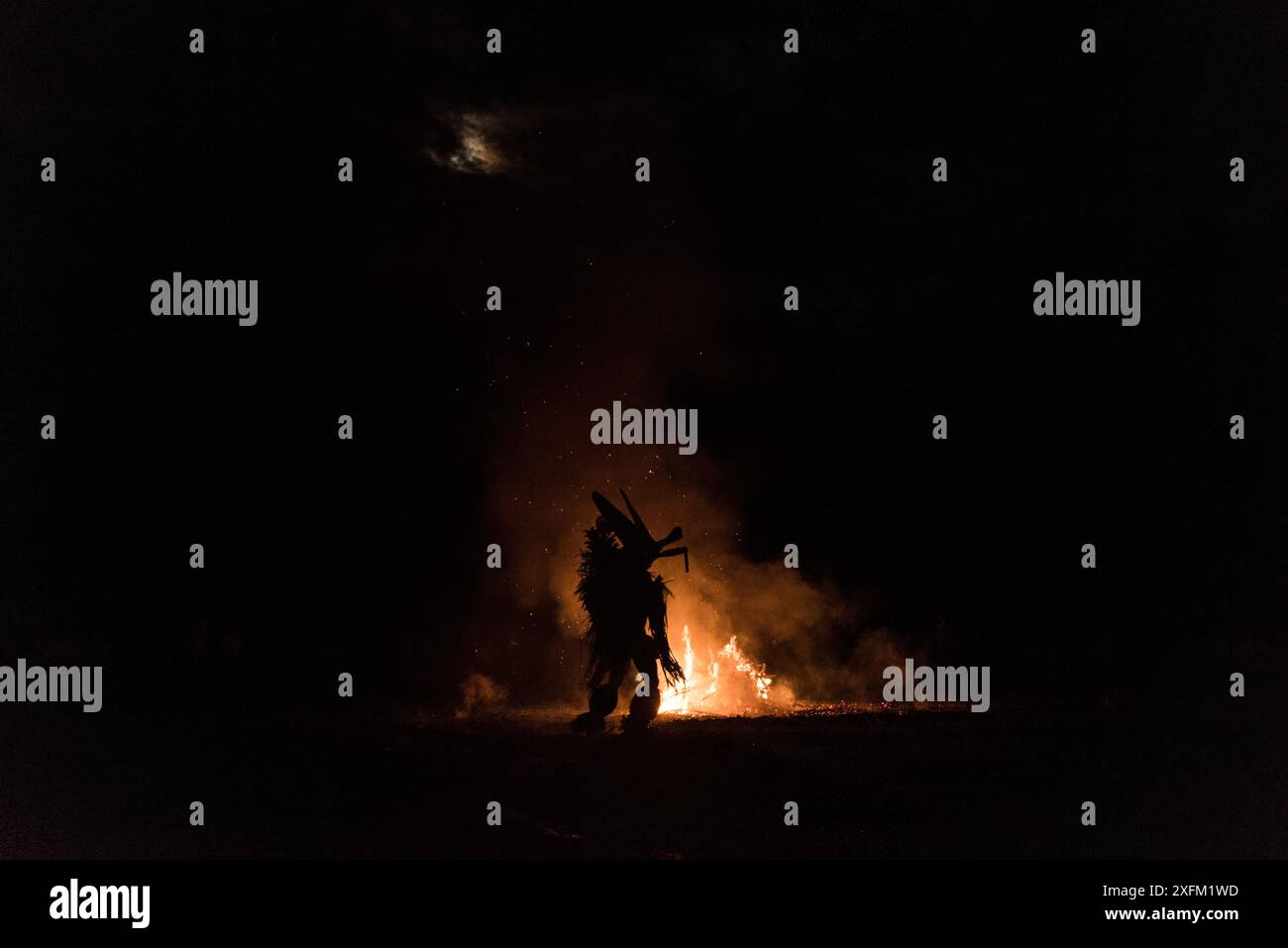Baining men in traditional fire dance ceremony. Men enter a trance like ...