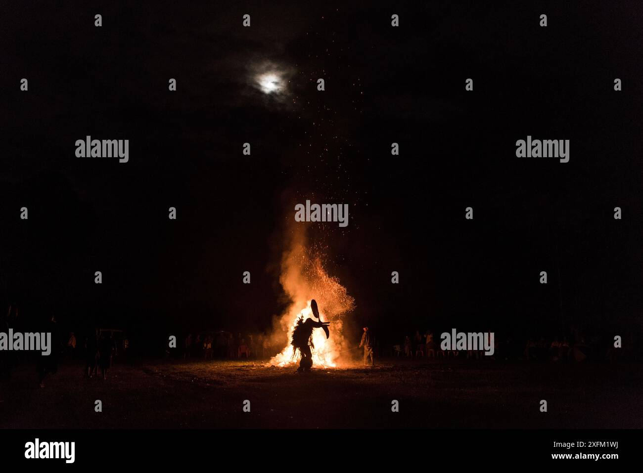 Baining men in traditional fire dance ceremony. Men enter a trance like ...