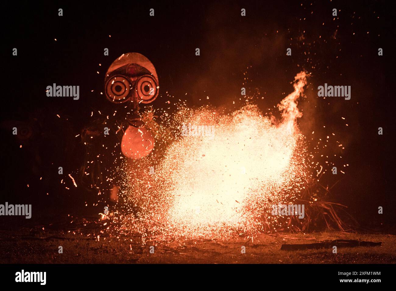 Baining men in traditional fire dance ceremony. Men enter a trance like ...