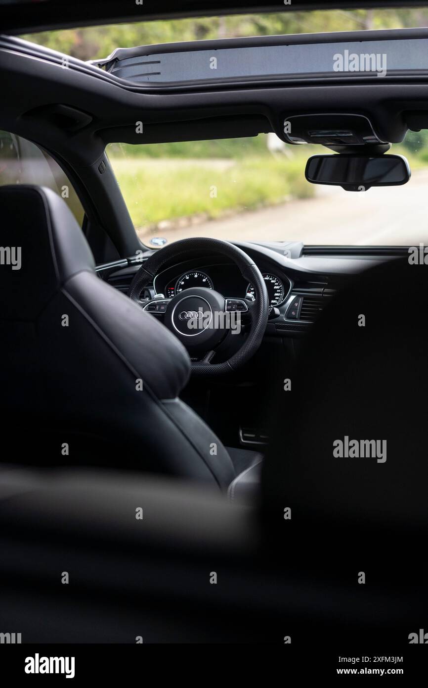 Audi RS6 interior view, steering wheel in focus, Luxury car cockpit ...