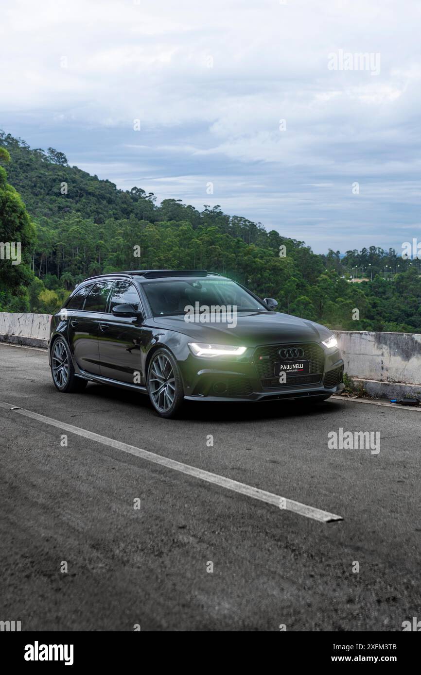 Black Audi RS6 front view, green mountain background, Luxury car on ...