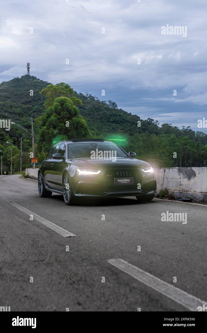 Black Audi RS6 front view, green mountain background, Luxury car on ...