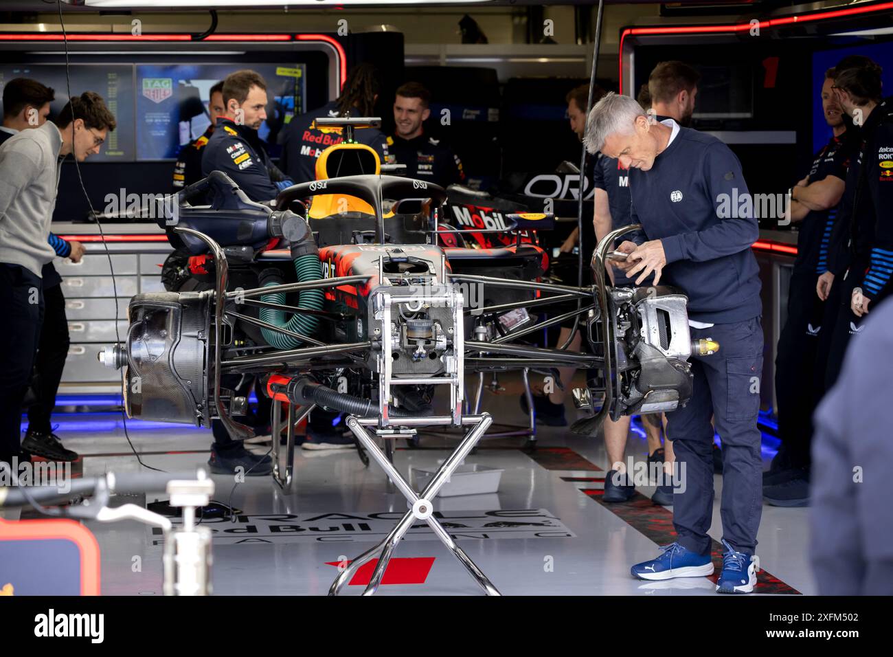 SILVERSTONE - 04/07/2024, An FIA employee checks the car of Max ...
