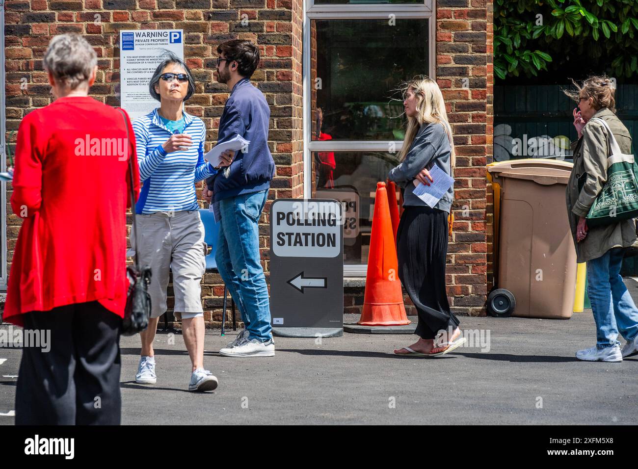 London, UK. 4th July, 2024. Large queues, including people of all ages ...