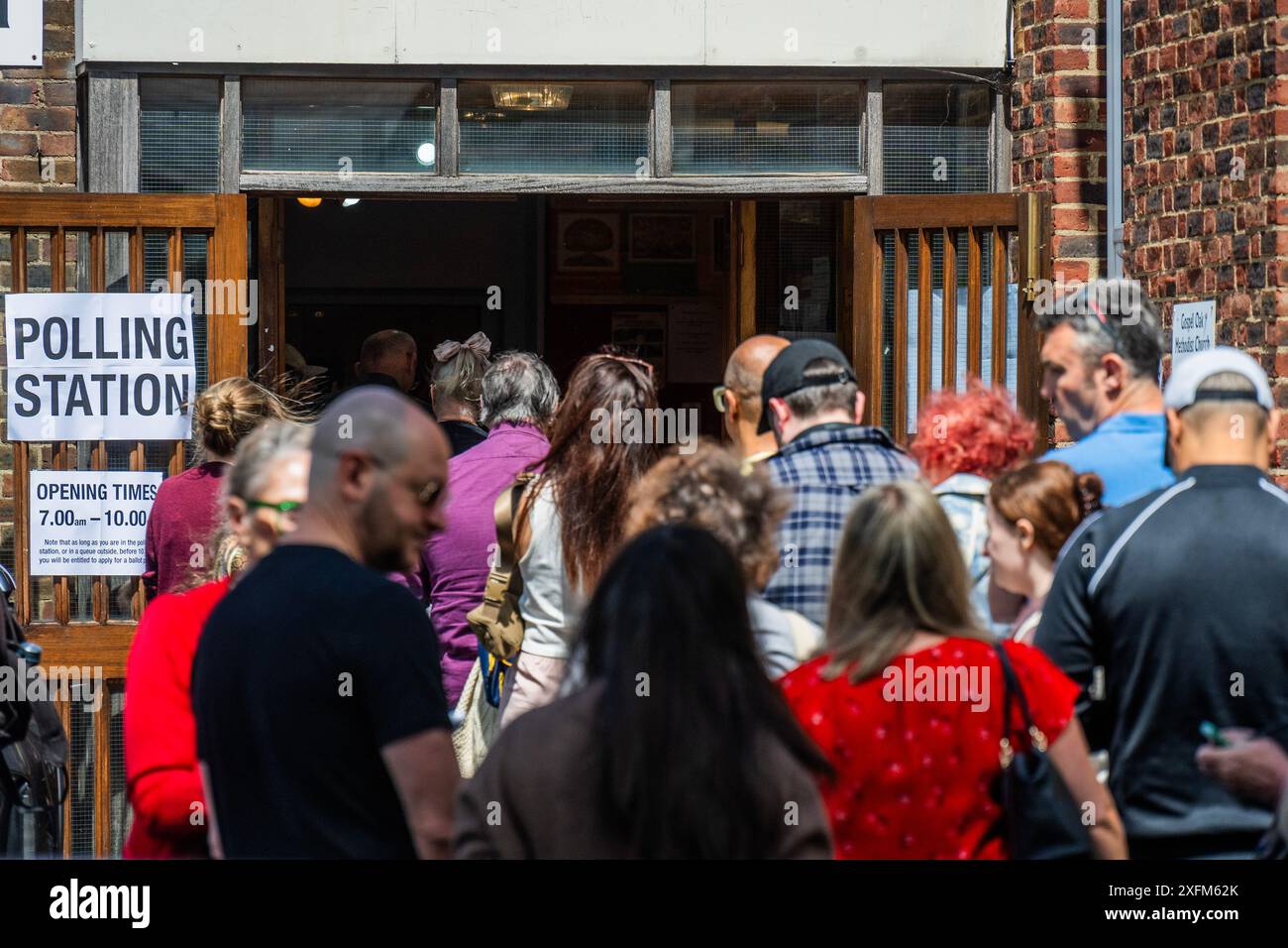 London, UK. 4th July, 2024. Large queues, including people of all ages ...