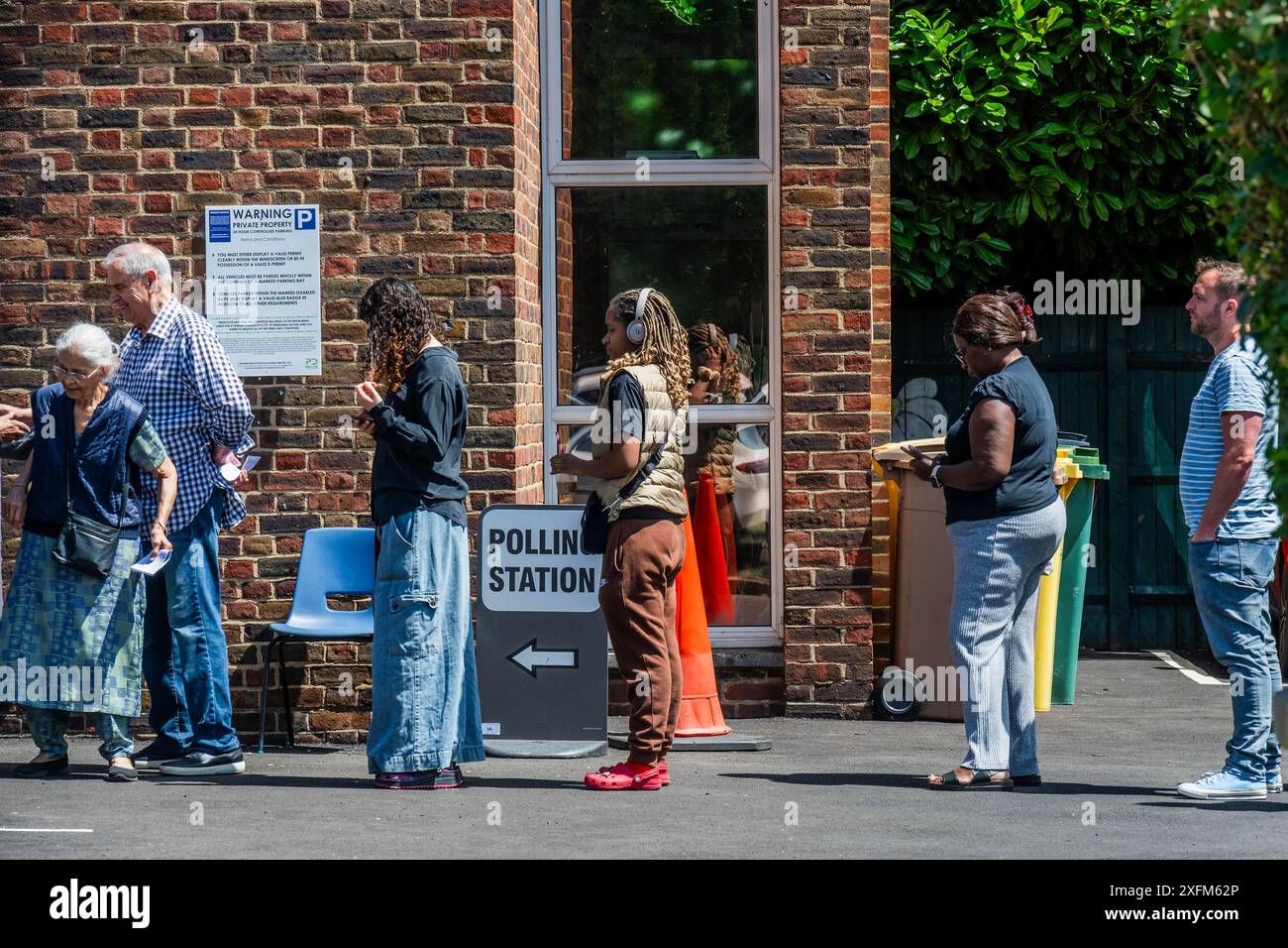 London, UK. 4th July, 2024. Large queues, including people of all ages ...