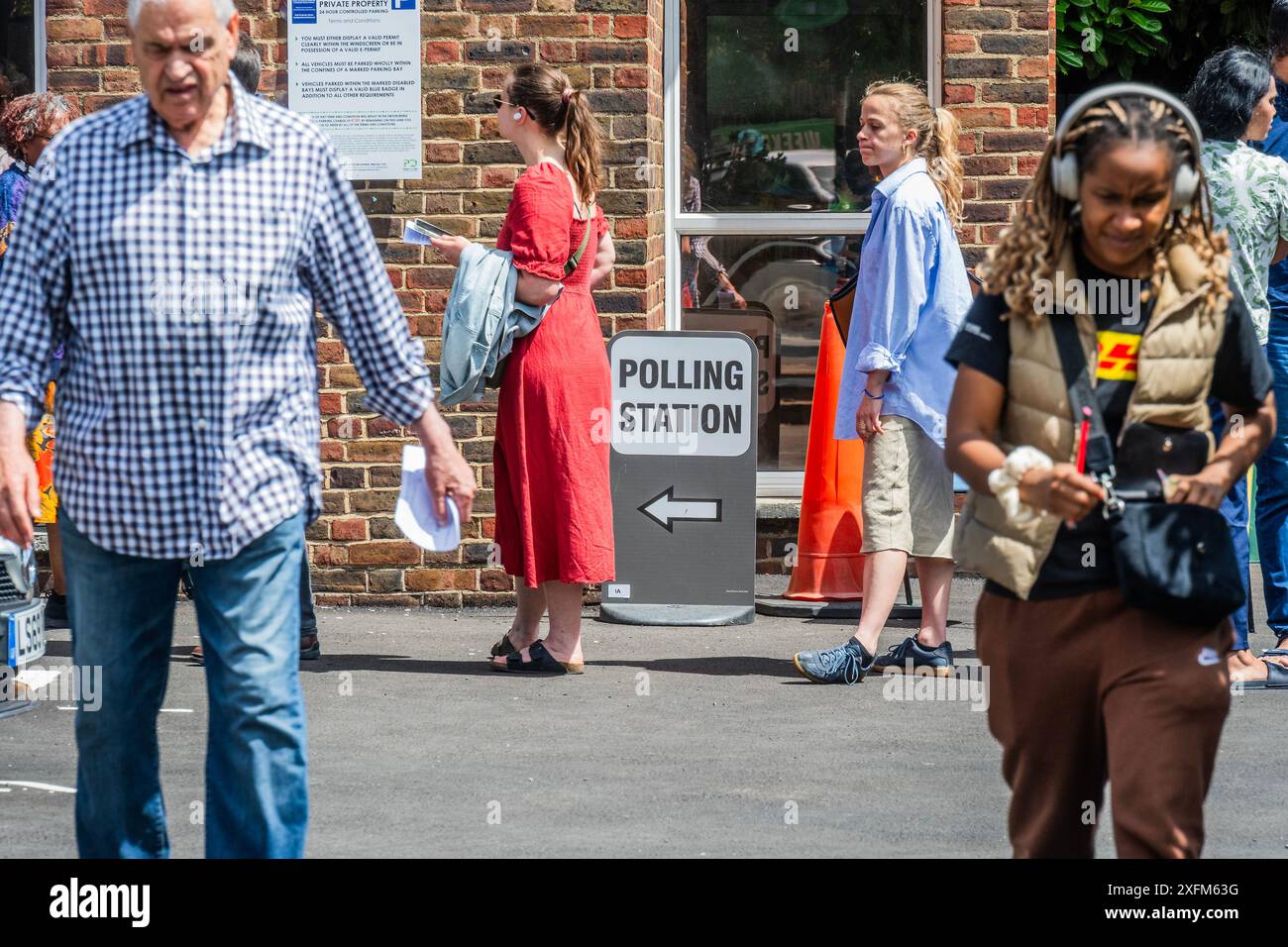 London, UK. 4th July, 2024. Large queues, including people of all ages ...