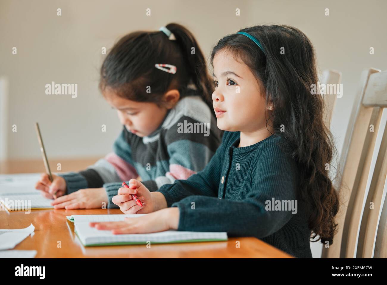 Girl, sisters and children writing for homework with learning ...