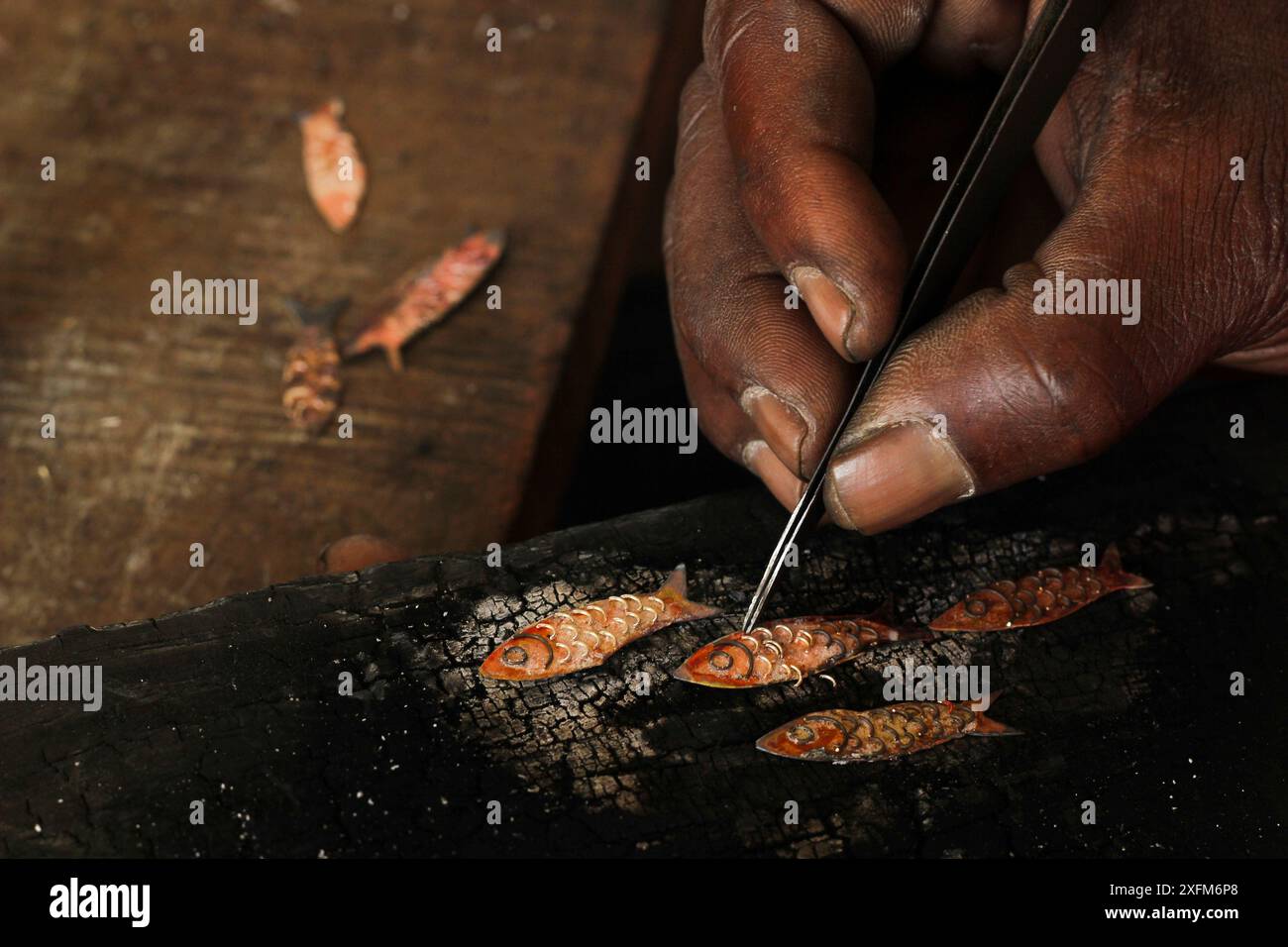 Silversmith using ancient Arabic techniques brought to the region by ...