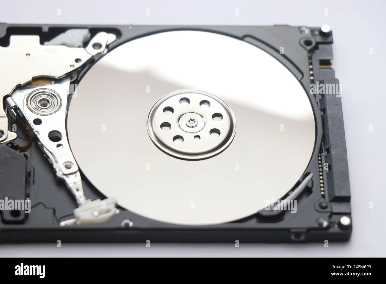 Open hard disk drive with a view of its inside parts. Hard disk with ...