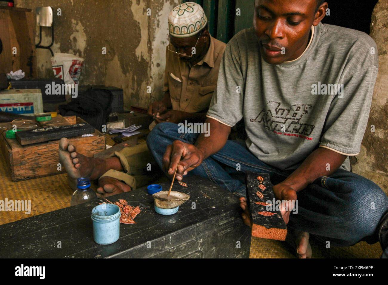 Silversmith using ancient Arabic techniques brought to the region by ...