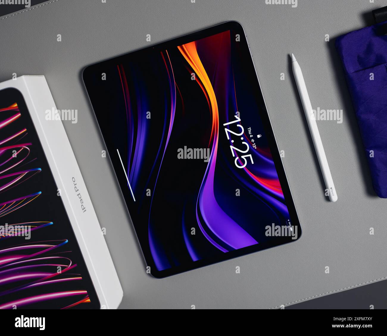 LONDON - JULY 04, 2024: Apple iPad Pro on desk with pencil stylus ...