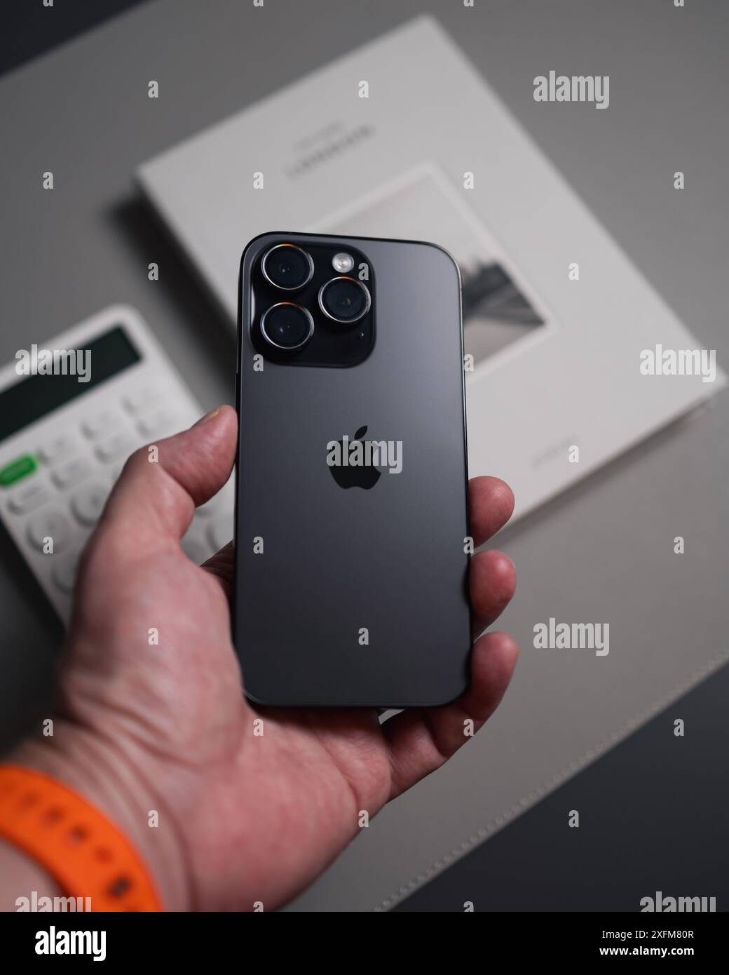 LONDON - JUNE 29, 2024: Man holding space black iPhone Pro in hand ...