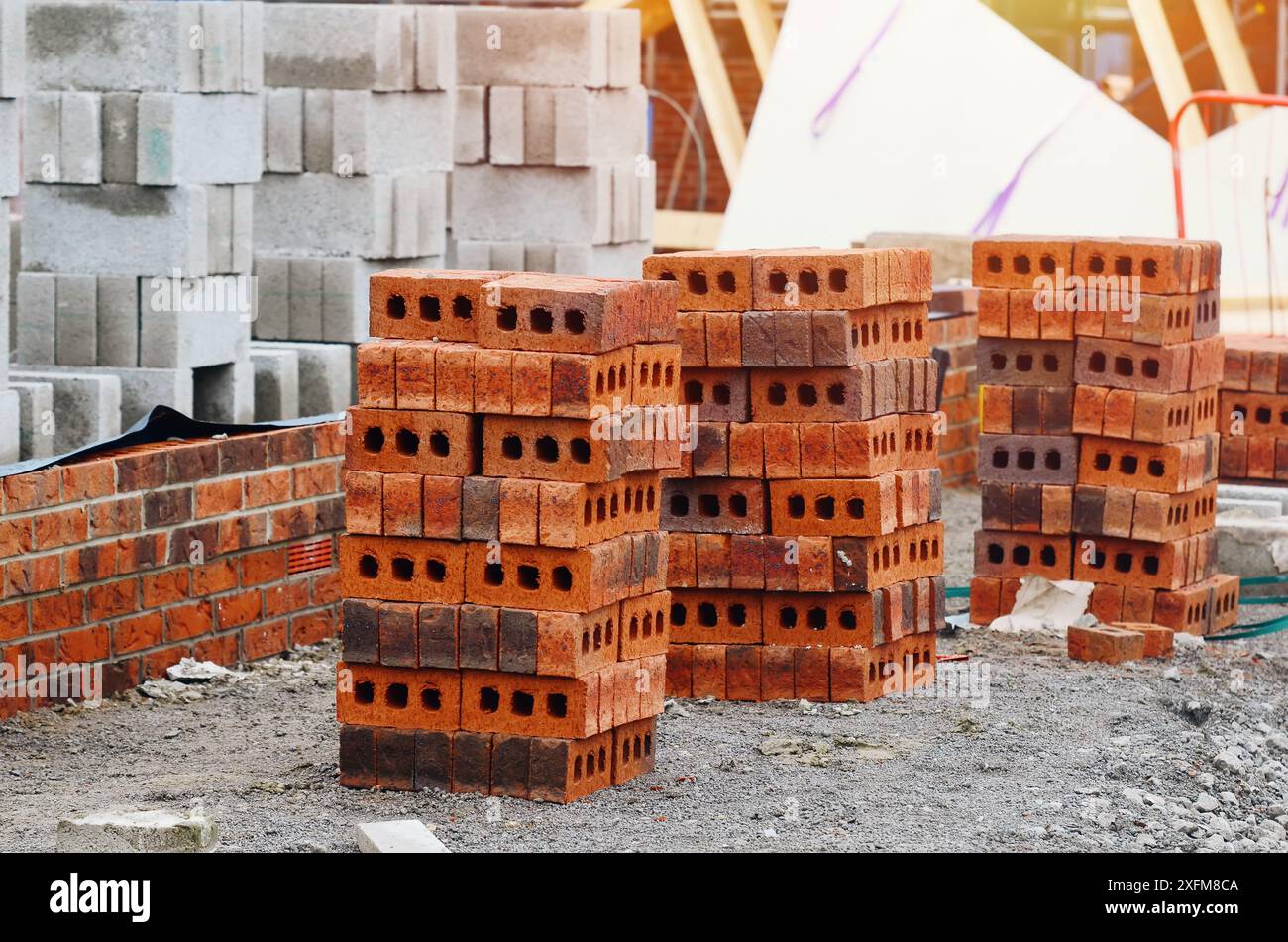 Red bricks and concrete blocks delivered on construction site and ...