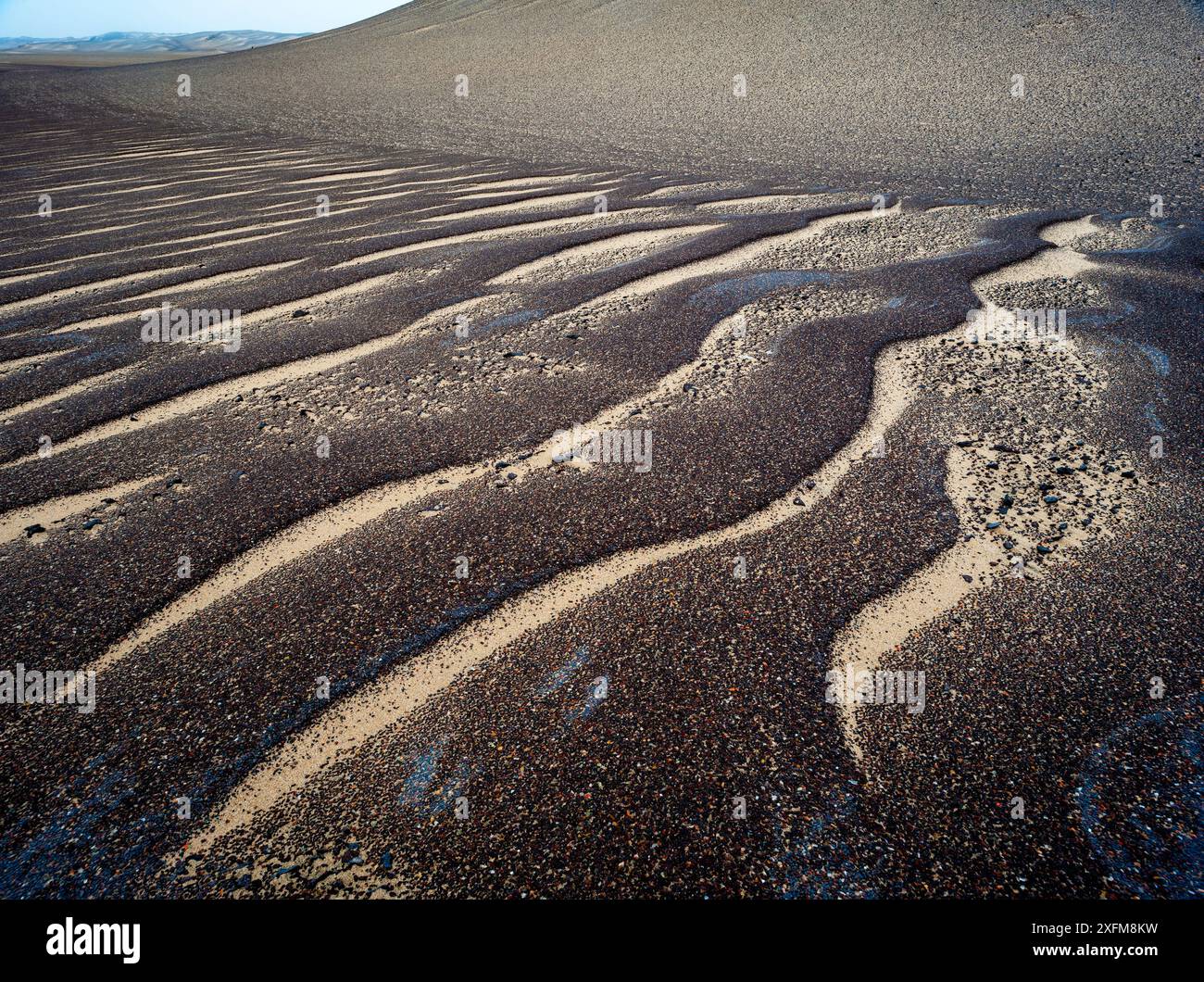 Black sands over-laying the beige sand dunes, Skeleton Coast National ...