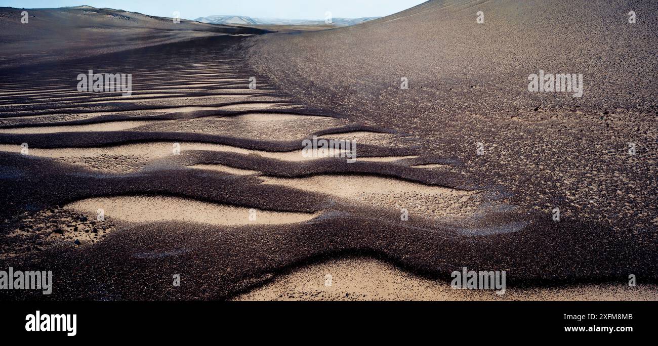 Black sands over-laying the beige sand dunes, Skeleton Coast National ...