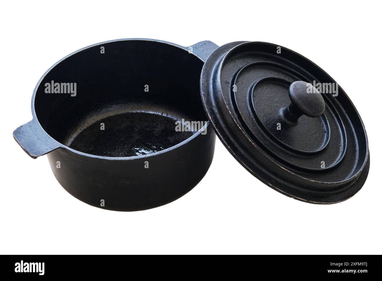 Cast iron used saucepan with open lid isolated on white background ...