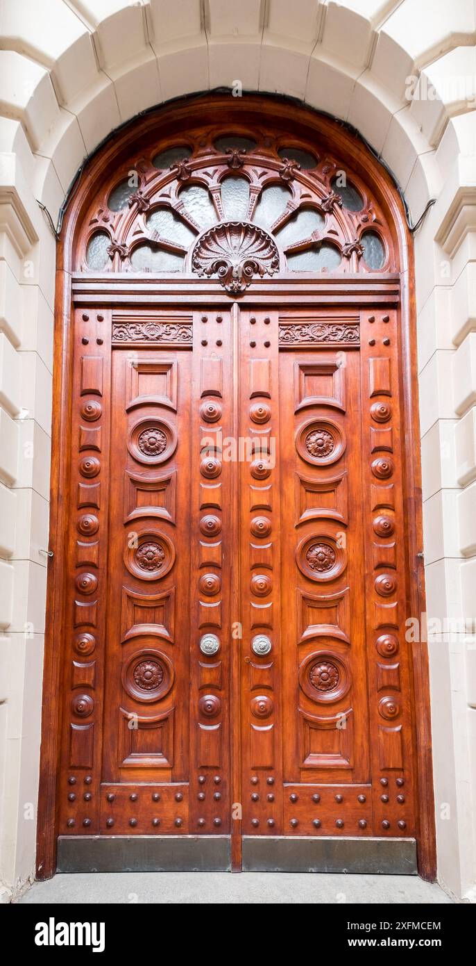 The door is made of wood and has a fancy design on it. The door has two ... The door is made of wood and has a fancy design on it. The door has two ...