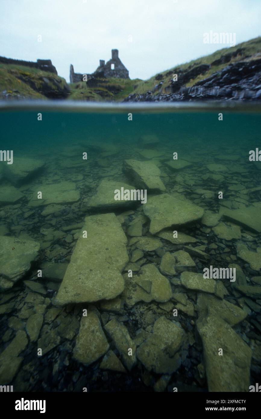 Split level view of flooded slate quarry on Belnahua island. Scotland ...