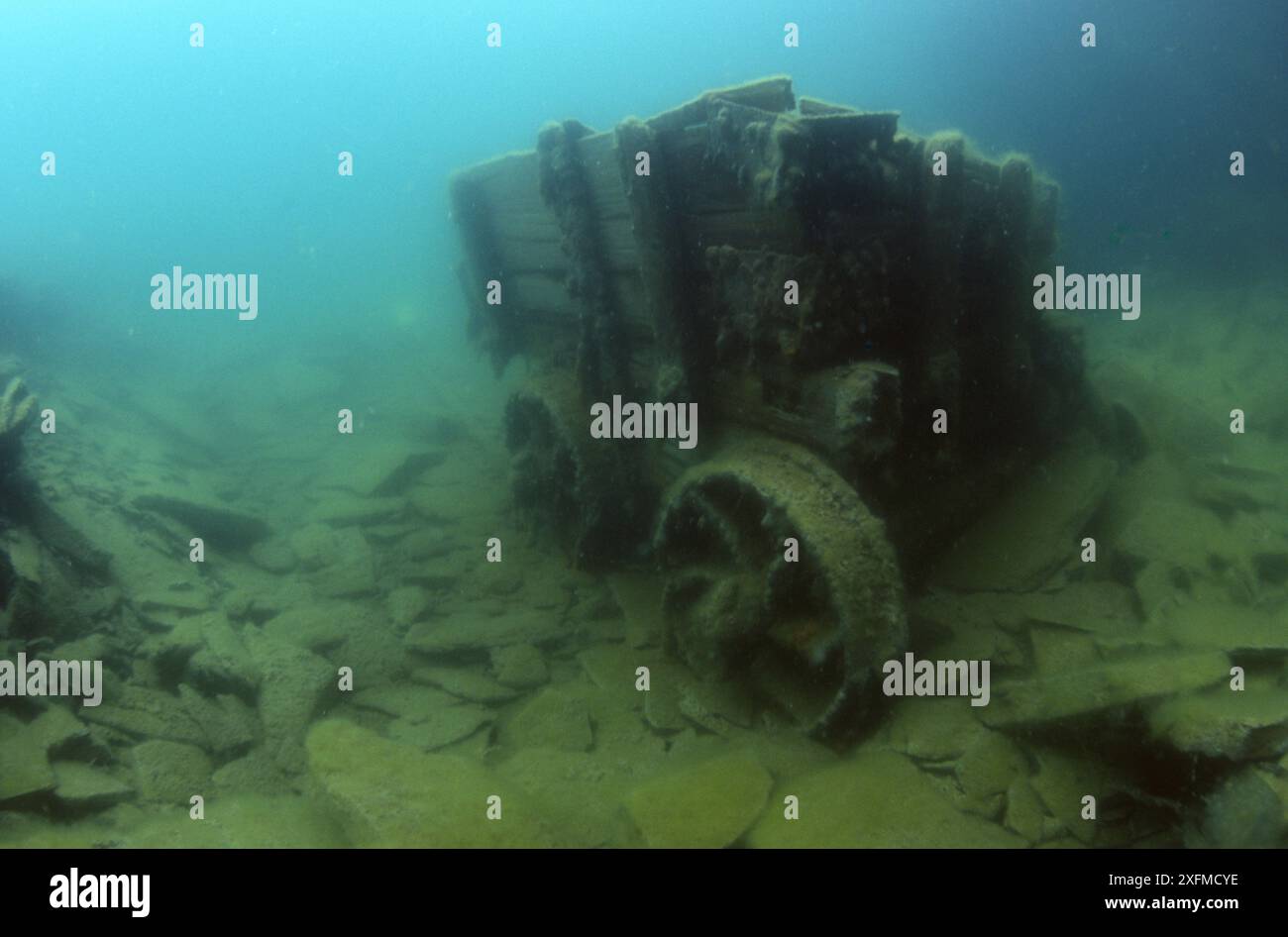 Mine cart in flooded slate quarry on Belnahua island. Scotland. 1996 ...
