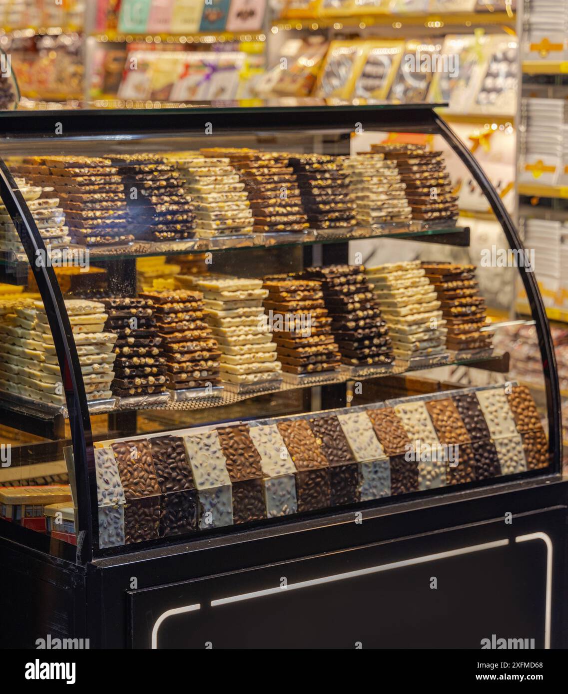 Stack of White Milk and Dark Chocolate Bars With Nuts at Shelf in ...