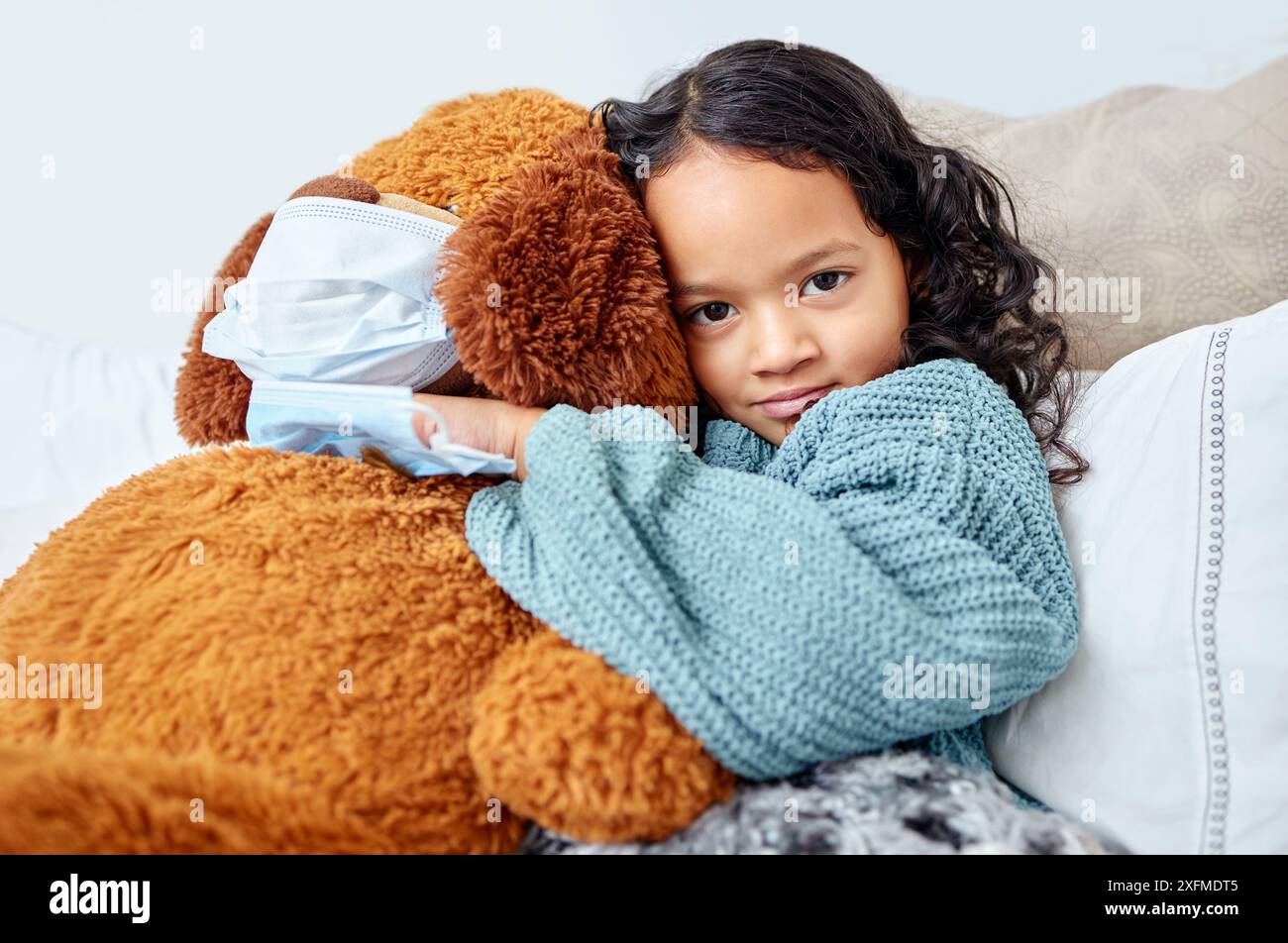 Girl child, portrait hug and teddy bear in bed with face mask for sick ...
