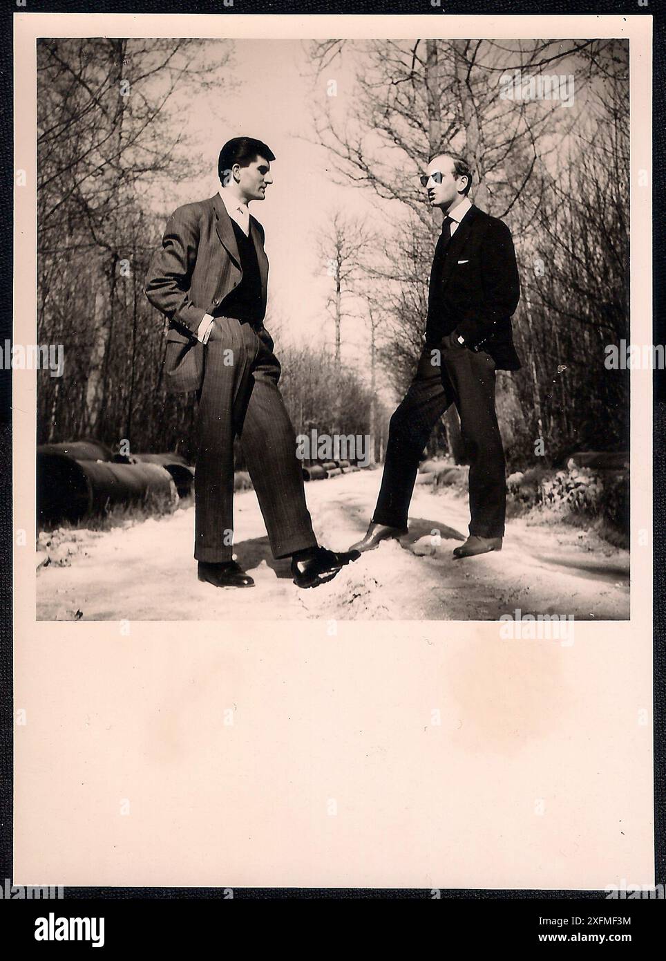 Vintage image of two men modelling suits in a snowing forest (1960s ...