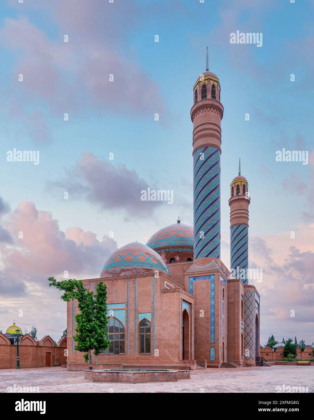 Side view of Goy Imam Mosque with its twin minarets and detailed ...