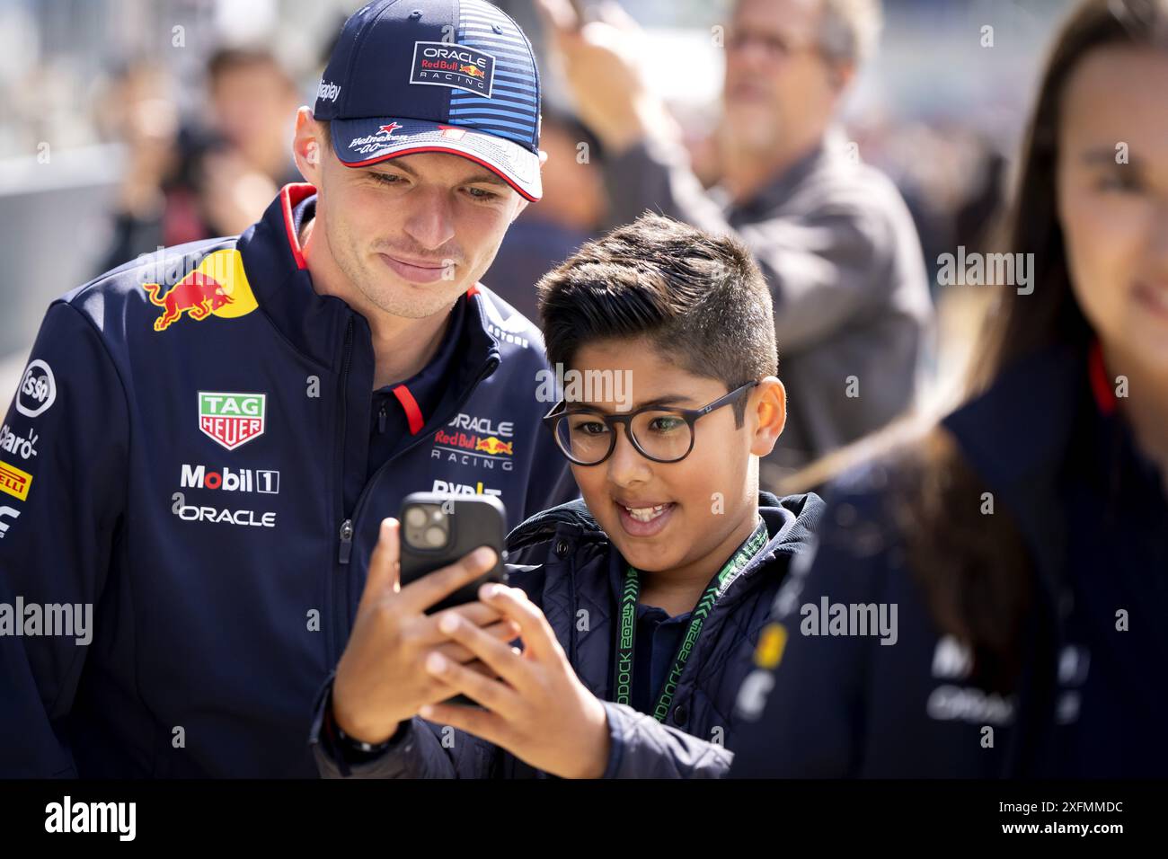 SILVERSTONE - Max Verstappen (Red Bull Racing) takes a photo with a fan ...