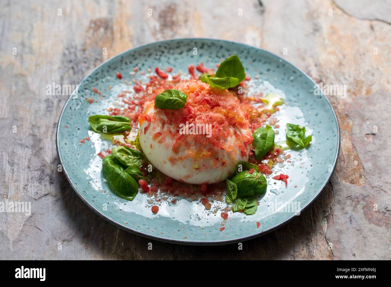 Burrata cheese with frozen tomato, basil and olive oil Stock Photo - Alamy